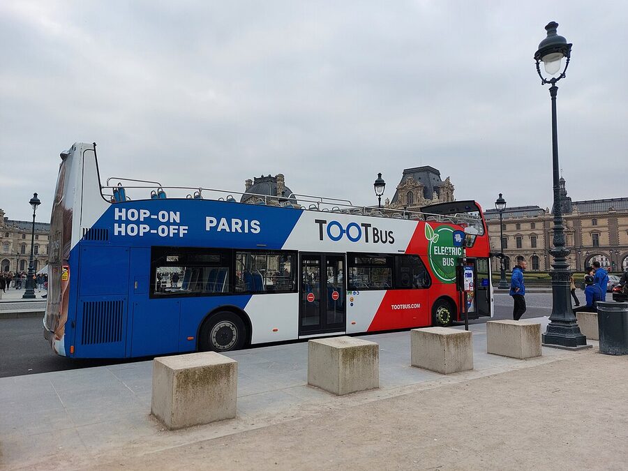 Tootbus electric hop on hop off bus at the Louvre Paris