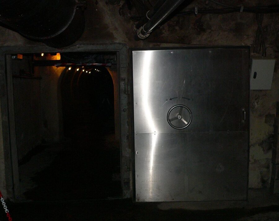 Stone vaulted arch inside a Paris sewer tunnel