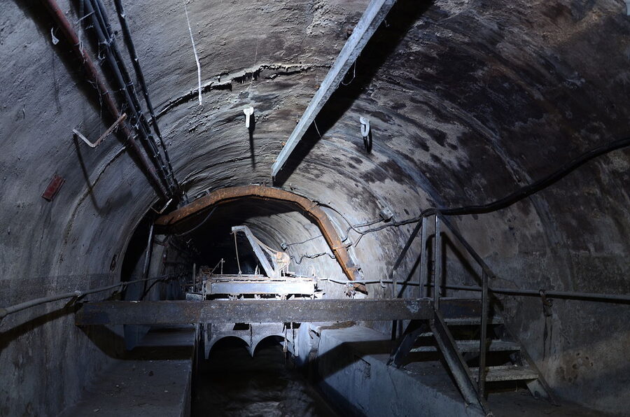 Long perspective view down a Paris Sewer Museum tunnel