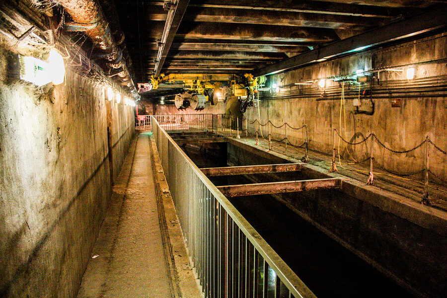 Pipes and cables running through Paris sewer tunnels