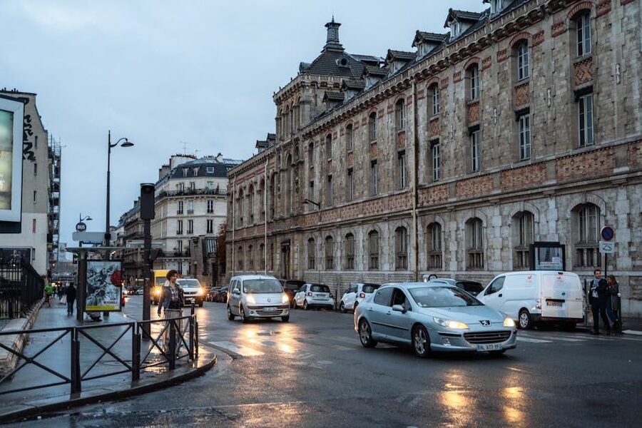 Paris street on a rainy night near Crazy Horse