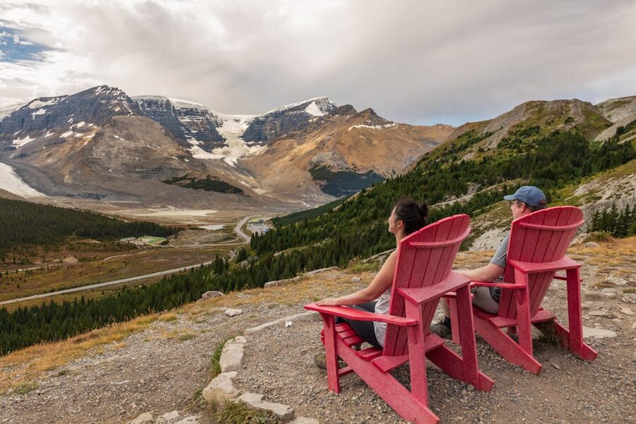Red chairs overlooking the Athabasca Glacier and Columbia Icefield