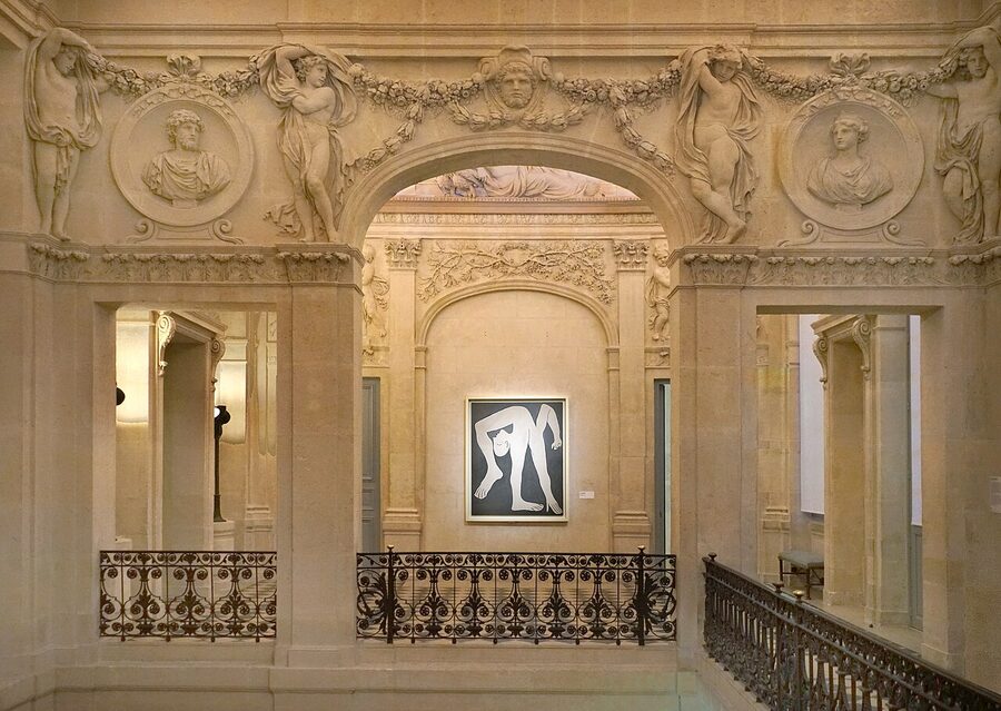 Salon Jupiter in the Picasso Museum Paris with stucco bas reliefs and Picasso's L'acrobate at center