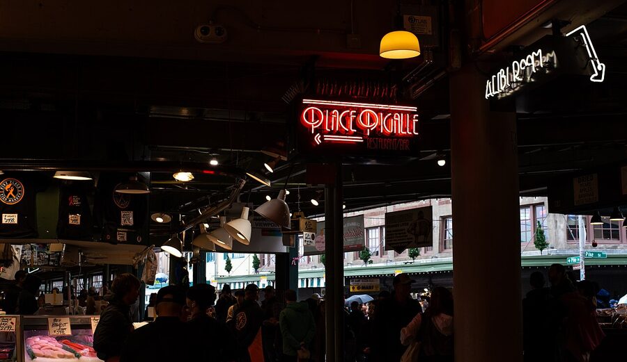 Neon signage inside Pike Place Market arcade Seattle