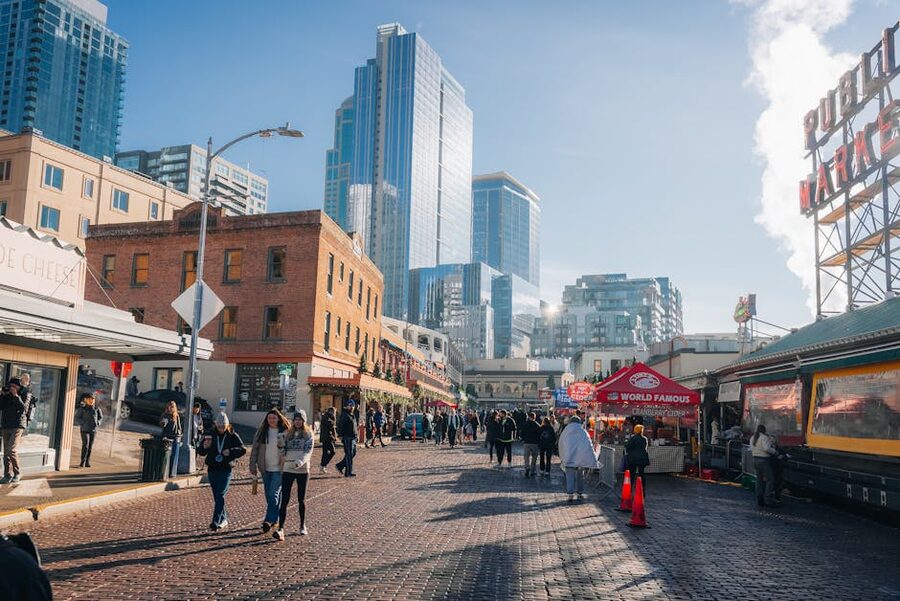Pike Place Market with Seattle skyline on sunny day