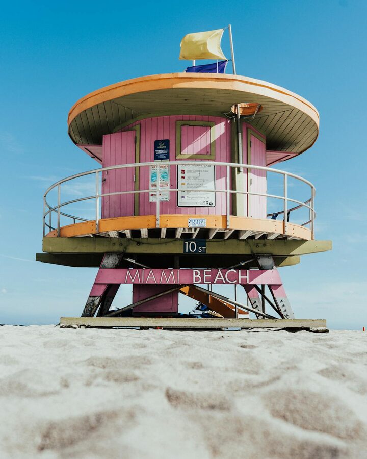 Bright pink lifeguard tower on a sunny day at Miami Beach