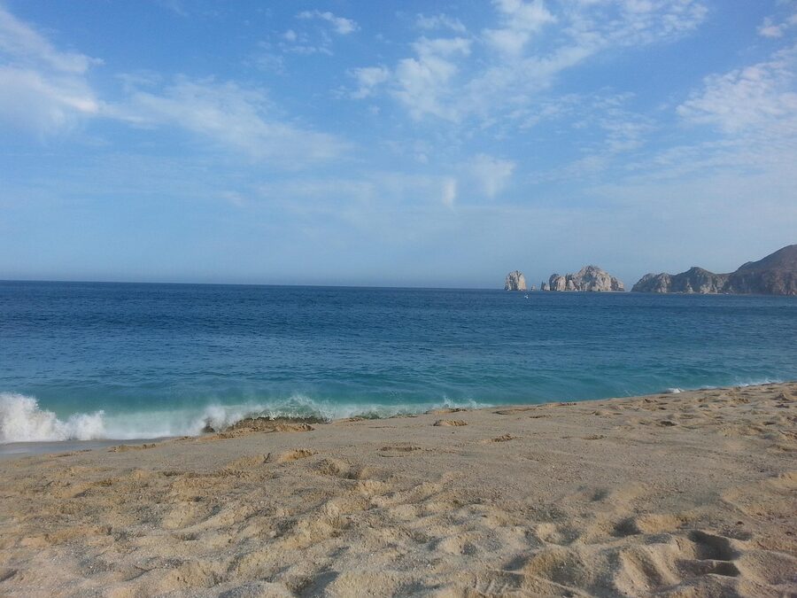 Cabo beach and arch coastline at dusk