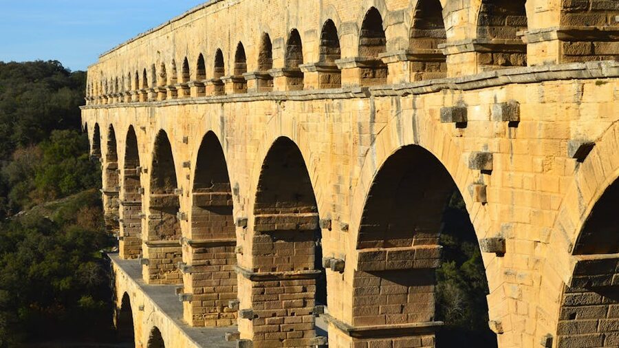 Pont du Gard bridge sunlit greenery lush French landscape