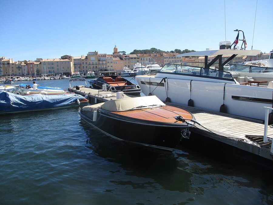 Saint-Tropez harbour with sailing yachts and waterfront cafes