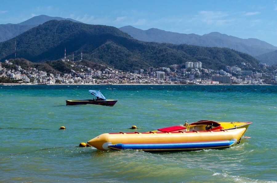Motorboats moored in Puerto Vallarta bay with Sierra Madre mountains