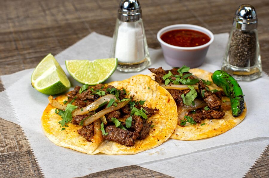 Beef tacos with corn tortillas and lime