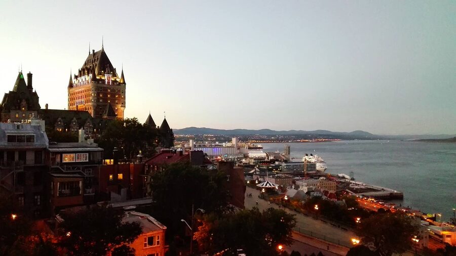 Quebec City panorama at sunset from the Dufferin Terrace overlooking the St Lawrence
