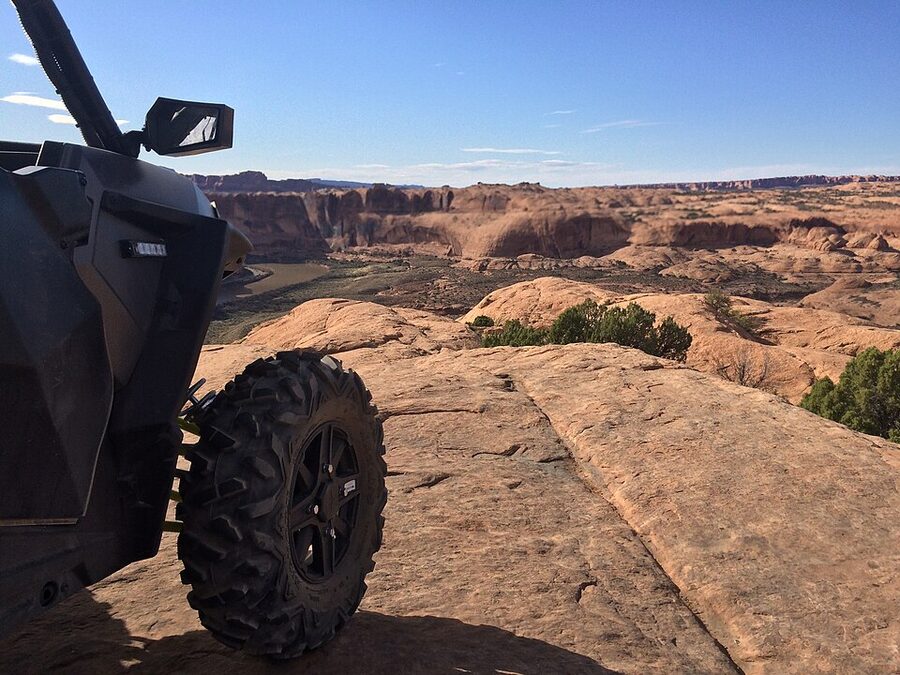 Razor UTV driving a slickrock section of Hell's Revenge Moab