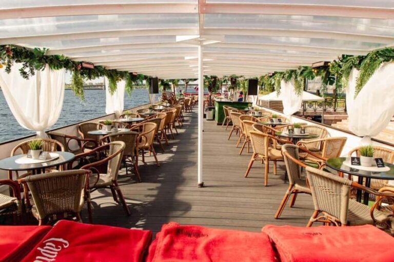 Riga: Sunset trip to Sea gates - River Cruises Latvia - The Boat: VECRGA’s Modern Comfort and Atmosphere