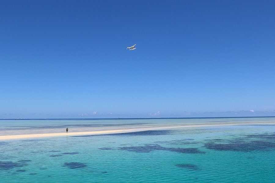 Pacific Island Air seaplane over Ro Ro Reef in the Mamanuca Islands