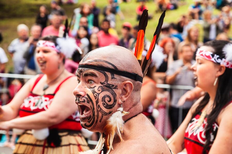 Maori performer with traditional facial markings during cultural performance