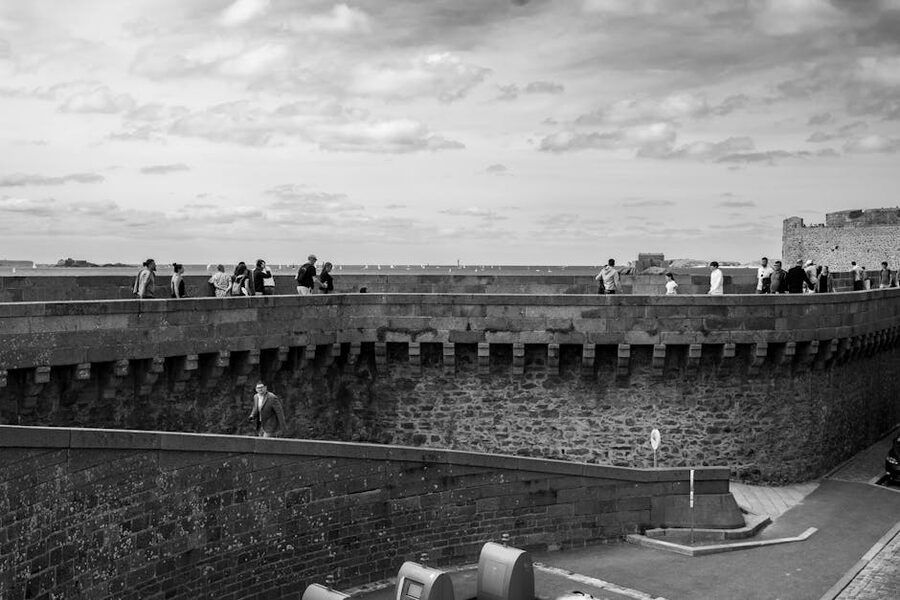 Visitors walking the Saint-Malo fortress walls in Brittany