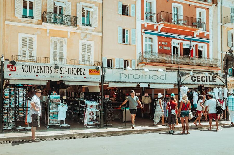 Saint-Tropez alley with souvenir shops and tourists