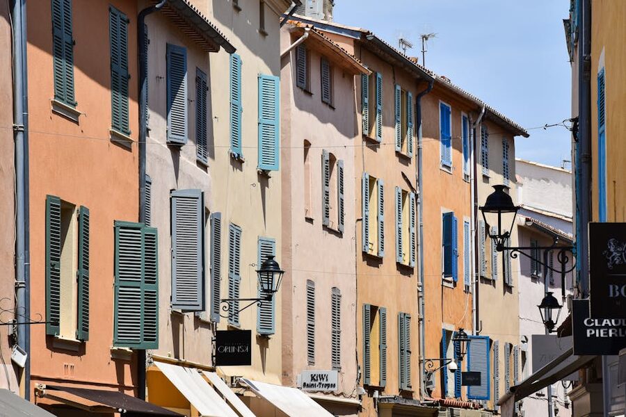 Pastel shuttered facades on a Saint-Tropez street
