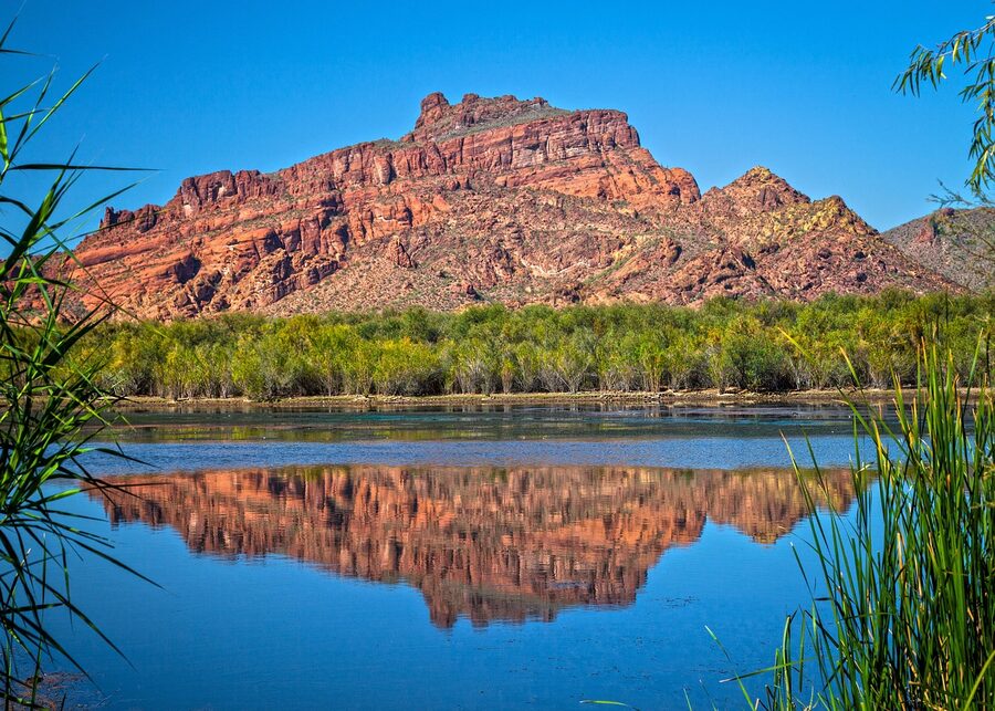 Red Mountain reflected in the still water of the Lower Salt River
