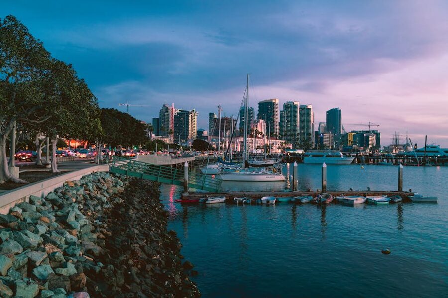 San Diego marina at twilight with skyline and docked boats