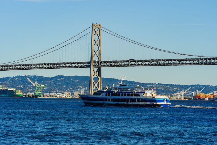 Ferry sailing under the San Francisco Bay Bridge