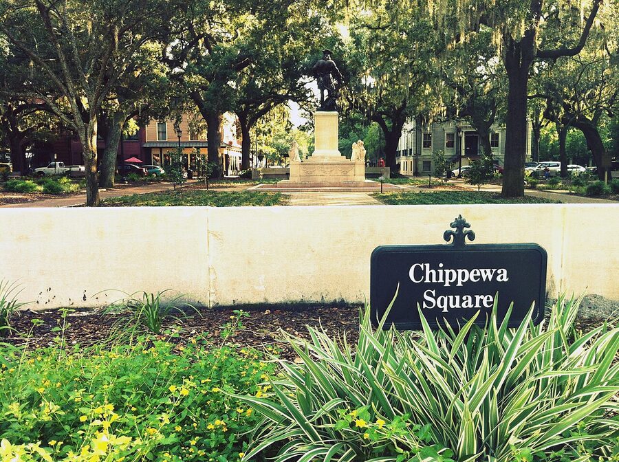 Chippewa Square in Savannah Georgia with oak trees and monuments