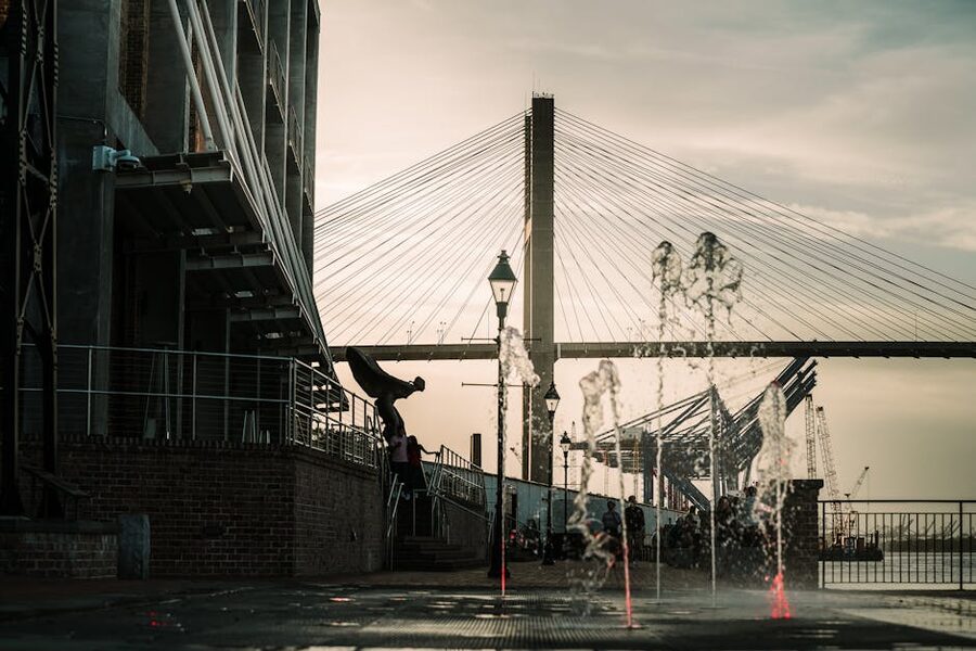 Savannah waterfront fountain with Talmadge Bridge at sunset