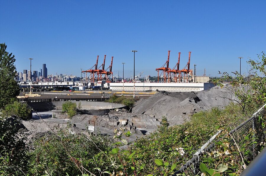 Container port cranes at Terminal 5 West Seattle with downtown skyline