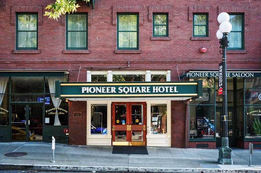 Pioneer Square hotel entrance in Seattle with historic brick facade