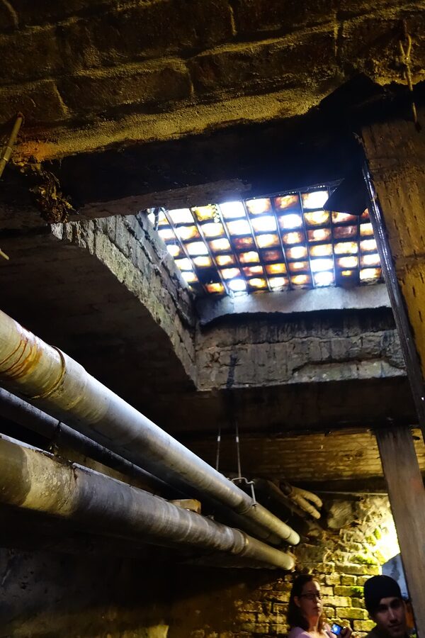 Purple glass skylights in the Seattle Underground seen from below