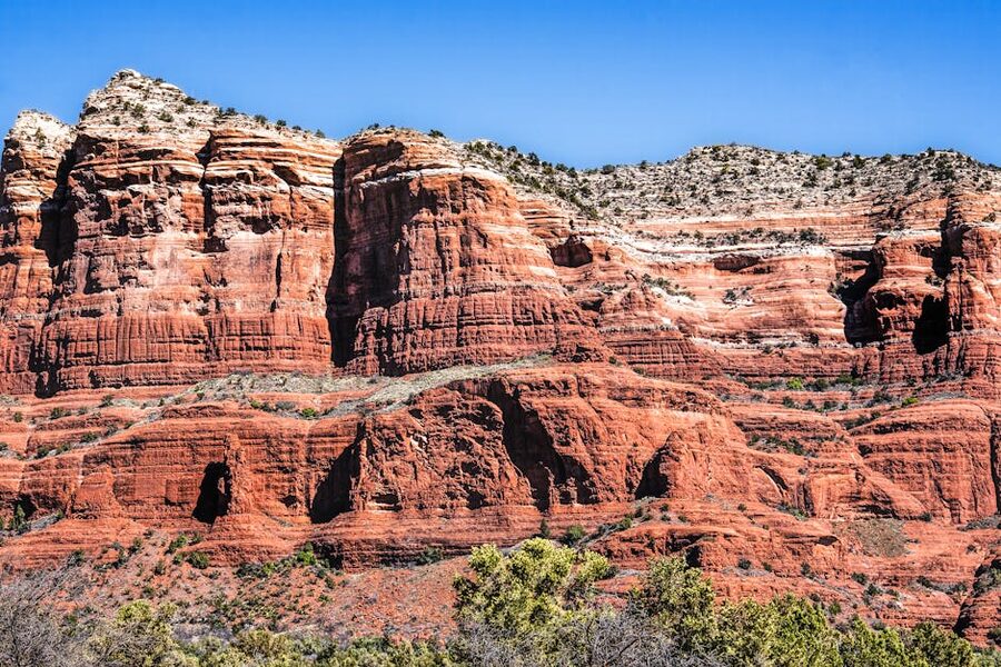 Sedona red rock formations under clear blue sky — the natural pair for a Verde Canyon Railroad day