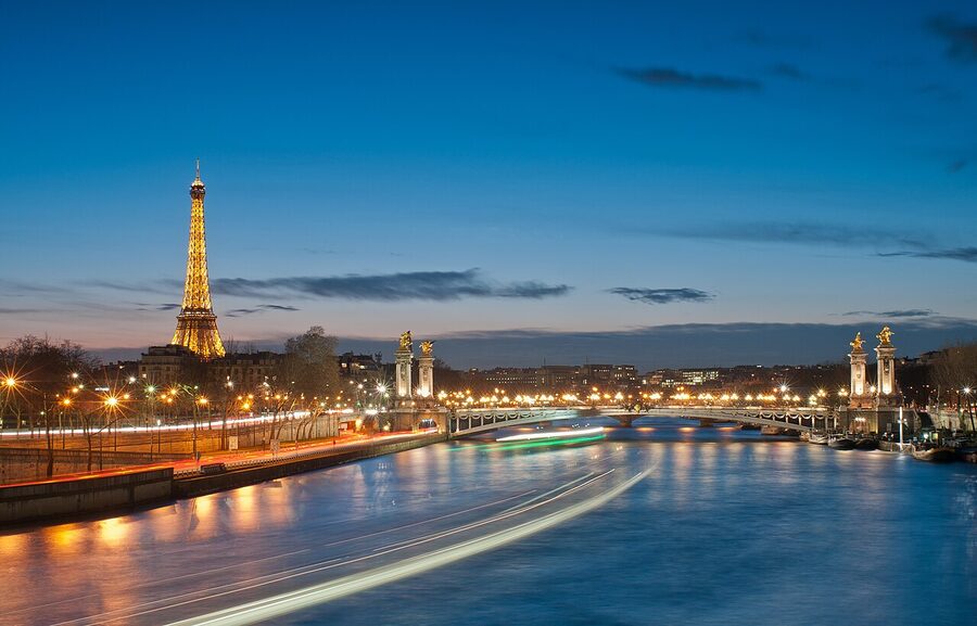 Pont Alexandre III bridge with Eiffel Tower at night Paris