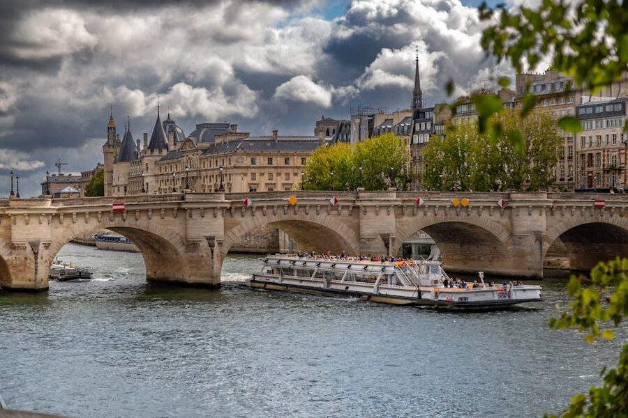 Cruise boat passing Pont Neuf on the Seine in Paris