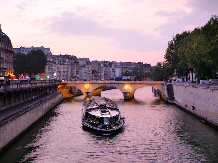 Seine River in Paris in the evening with cruise boats