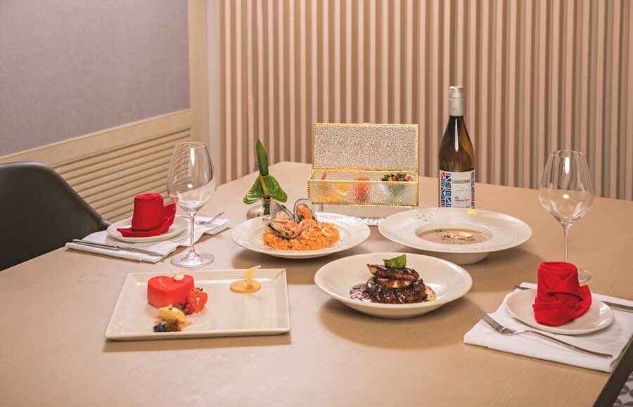 Fine dining table set for a Seine dinner cruise with seafood and wine