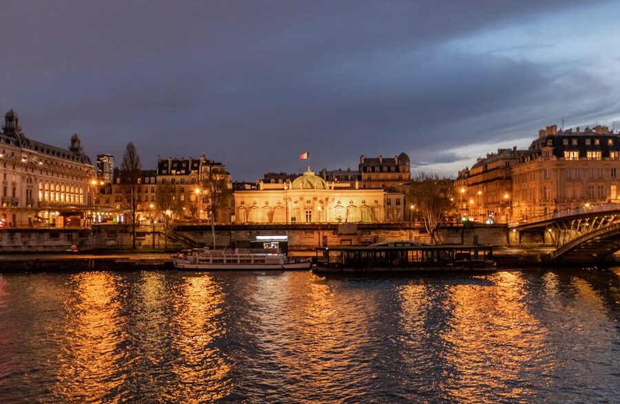 Illuminated Paris bridges over the Seine at night