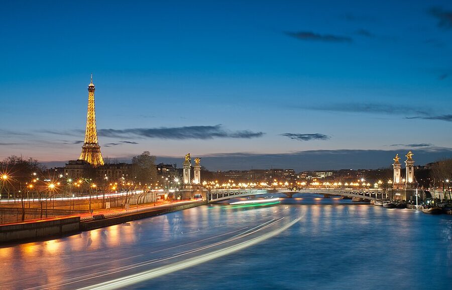 Eiffel Tower and Pont Alexandre III at night during the sparkle, Paris