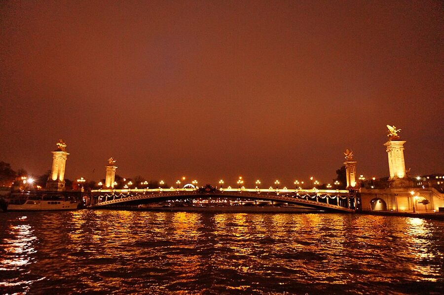 Pont Alexandre III seen from the Seine river at night