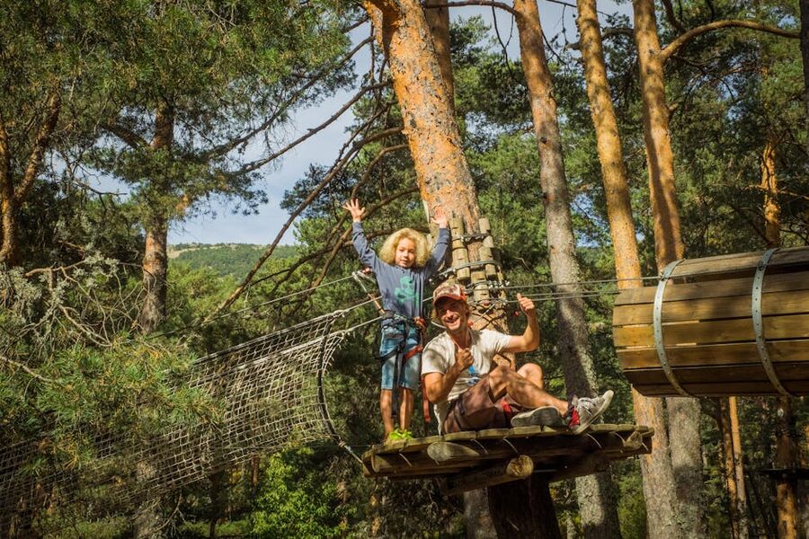 Father and child together on a family zipline tour