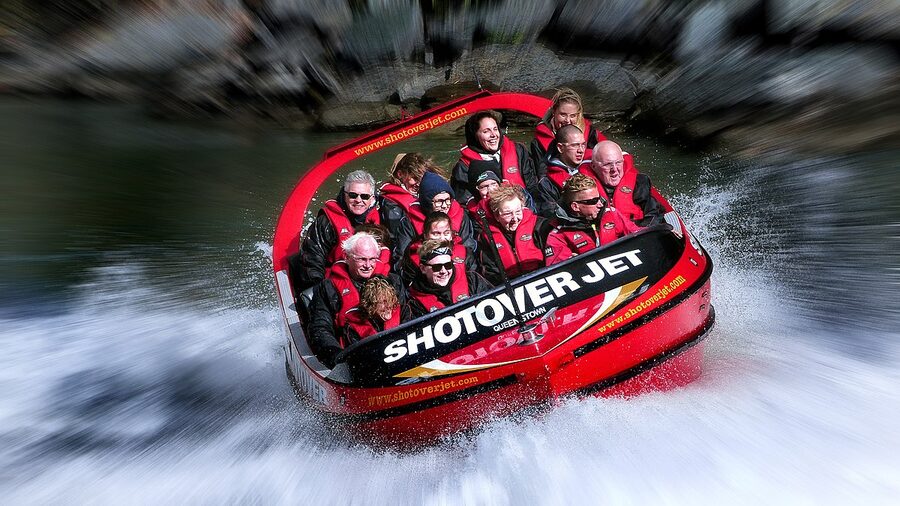 Thrill seekers on the Shotover Jet wearing splash jackets