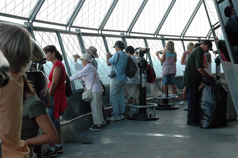 Tourists and staff inside the Skylon Tower observation deck