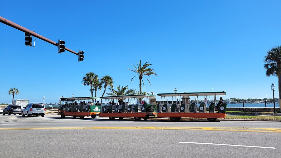 Old Town Trolley passing the Castillo de San Marcos fort walls