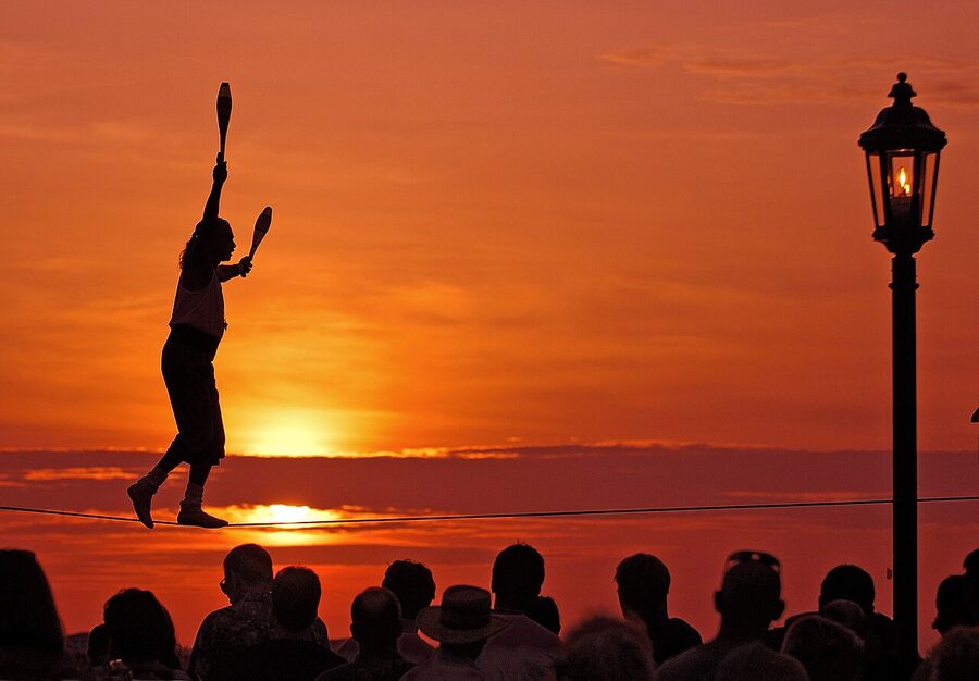 A tightrope walker performing at the Mallory Square Sunset Celebration Key West