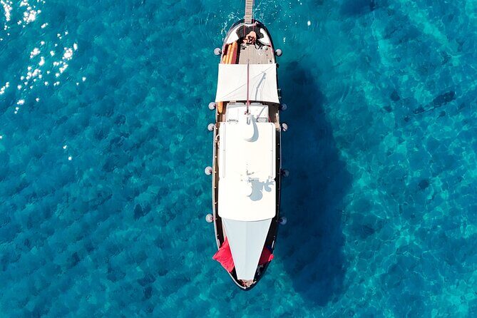 Sunset with dolphins on a vintage tugboat in Golfo Aranci - Why This Tour Stands Out