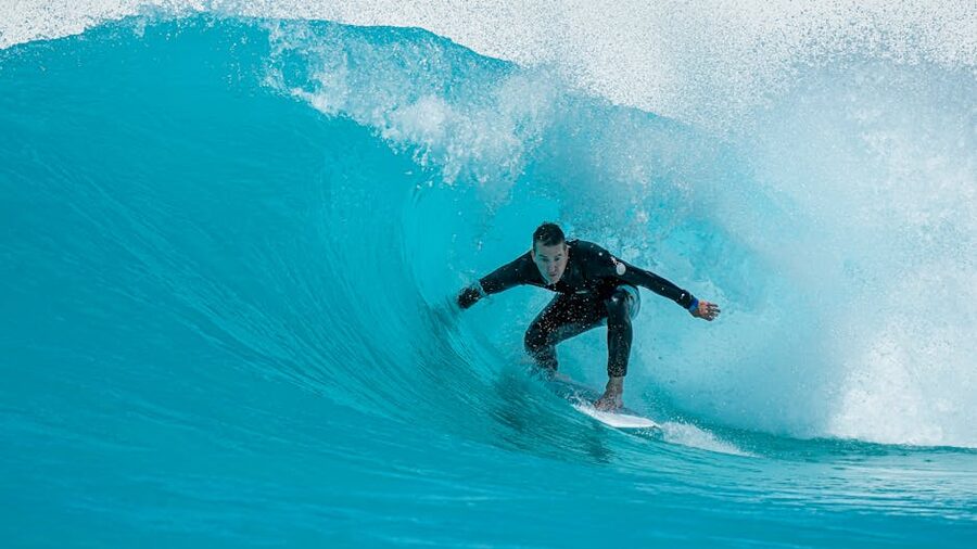 A surfer riding a wave at a Western Australia beach