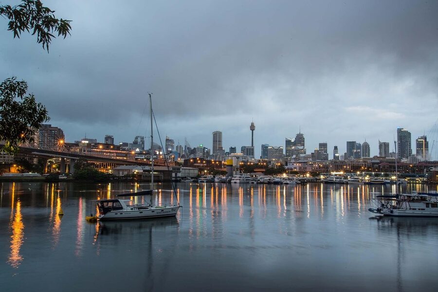 Sydney Harbour Bridge at dawn with boats in the foreground