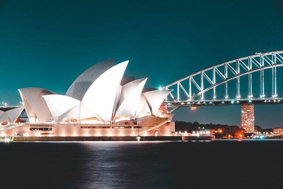 Sydney Opera House illuminated at night with Harbour Bridge