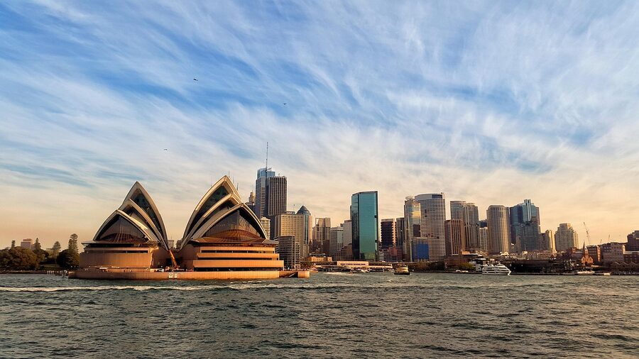 Sydney Opera House at sunrise from across the harbour