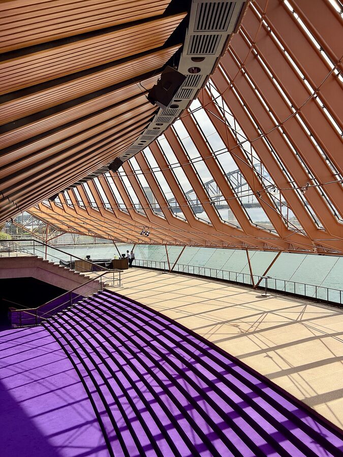 Sydney Opera House interior showing glass walls and harbour view from inside the sail
